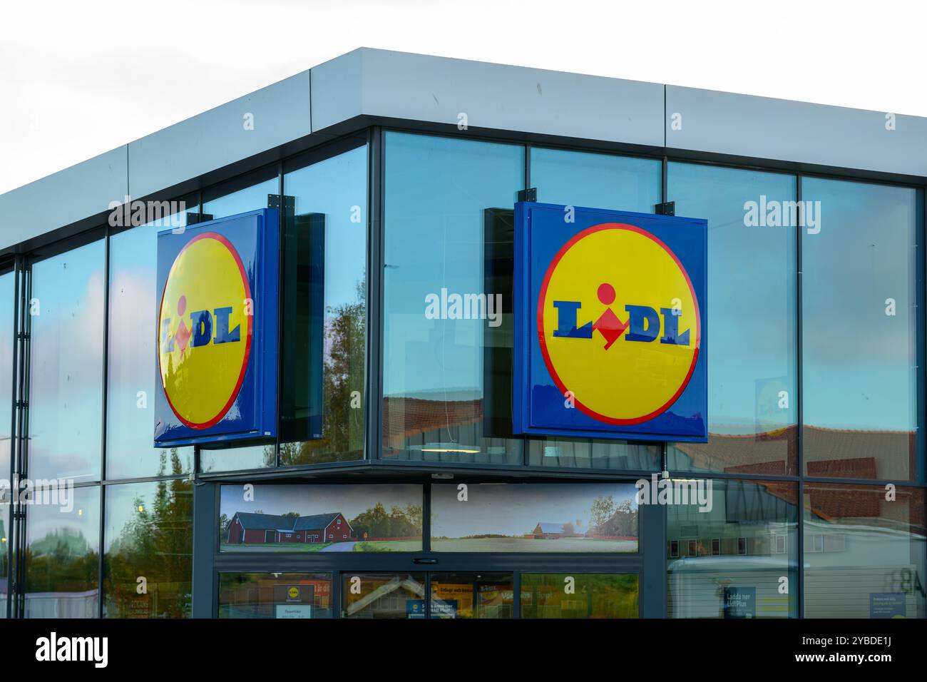 The Lidl store stands prominently with a blue and yellow sign ...