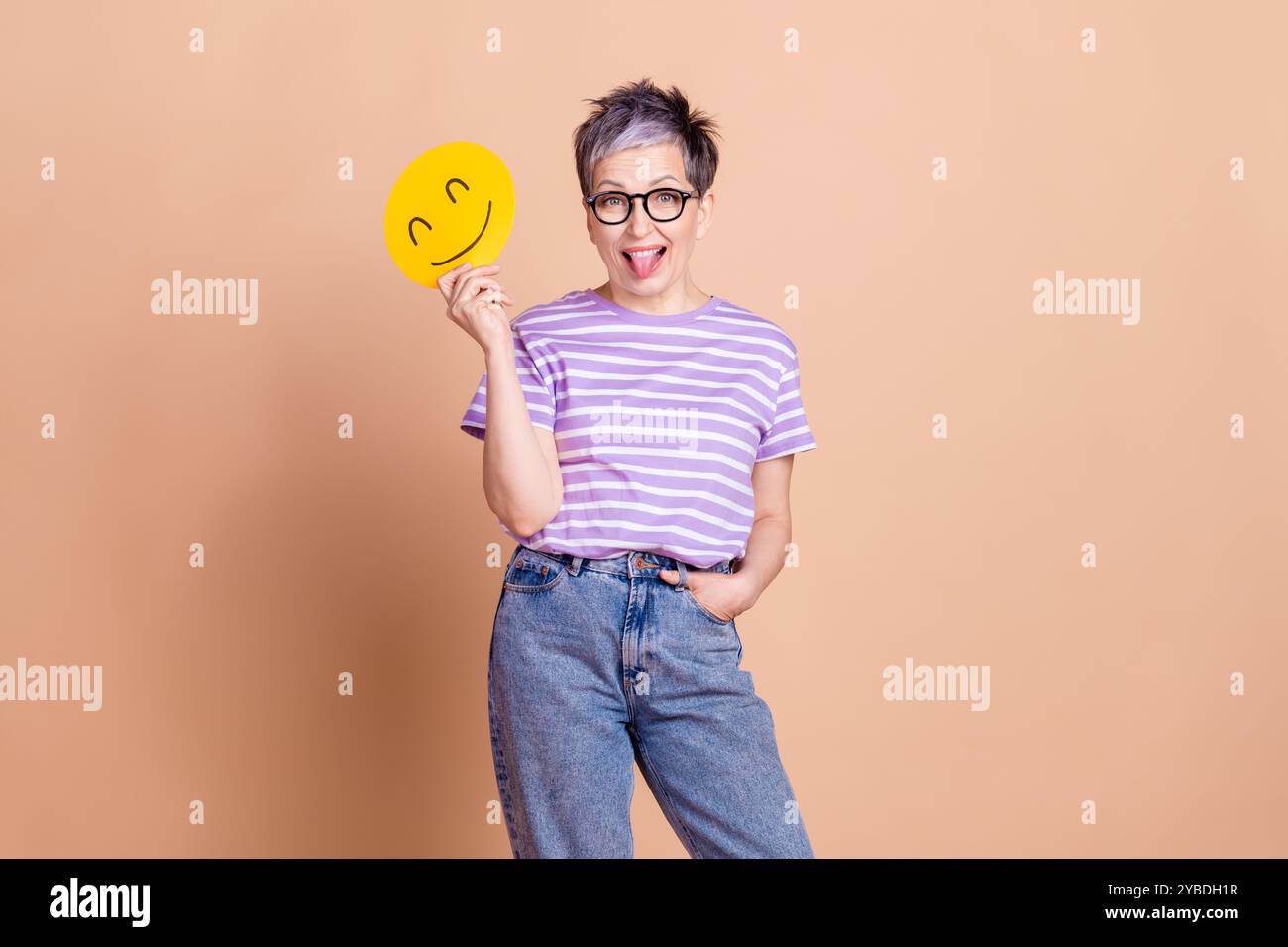 Photo of lovely positive funky woman wear striped stylish clothes hold ...