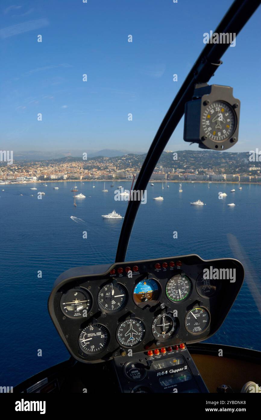 Inside the Cockpit of a flying Robinson44 Helicopter showing the ...