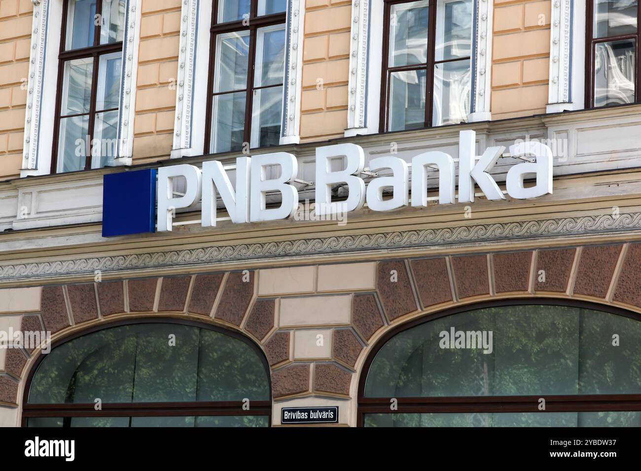 Riga, Latvia - May 26, 2024: PNB Banka logo on a wall. PNB Banka was ...