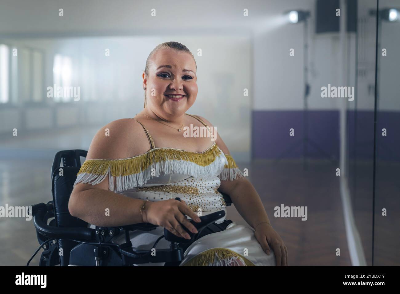 Female dancer with disability during wheelchair ballroom dancing ...