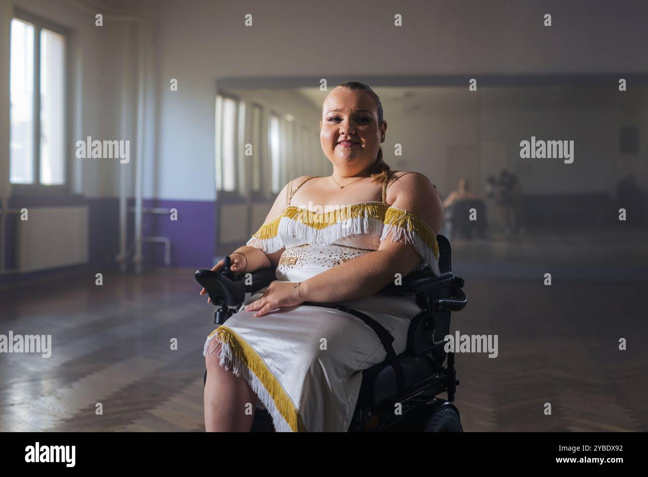 Confident pretty young woman with a disability, on her electric ...