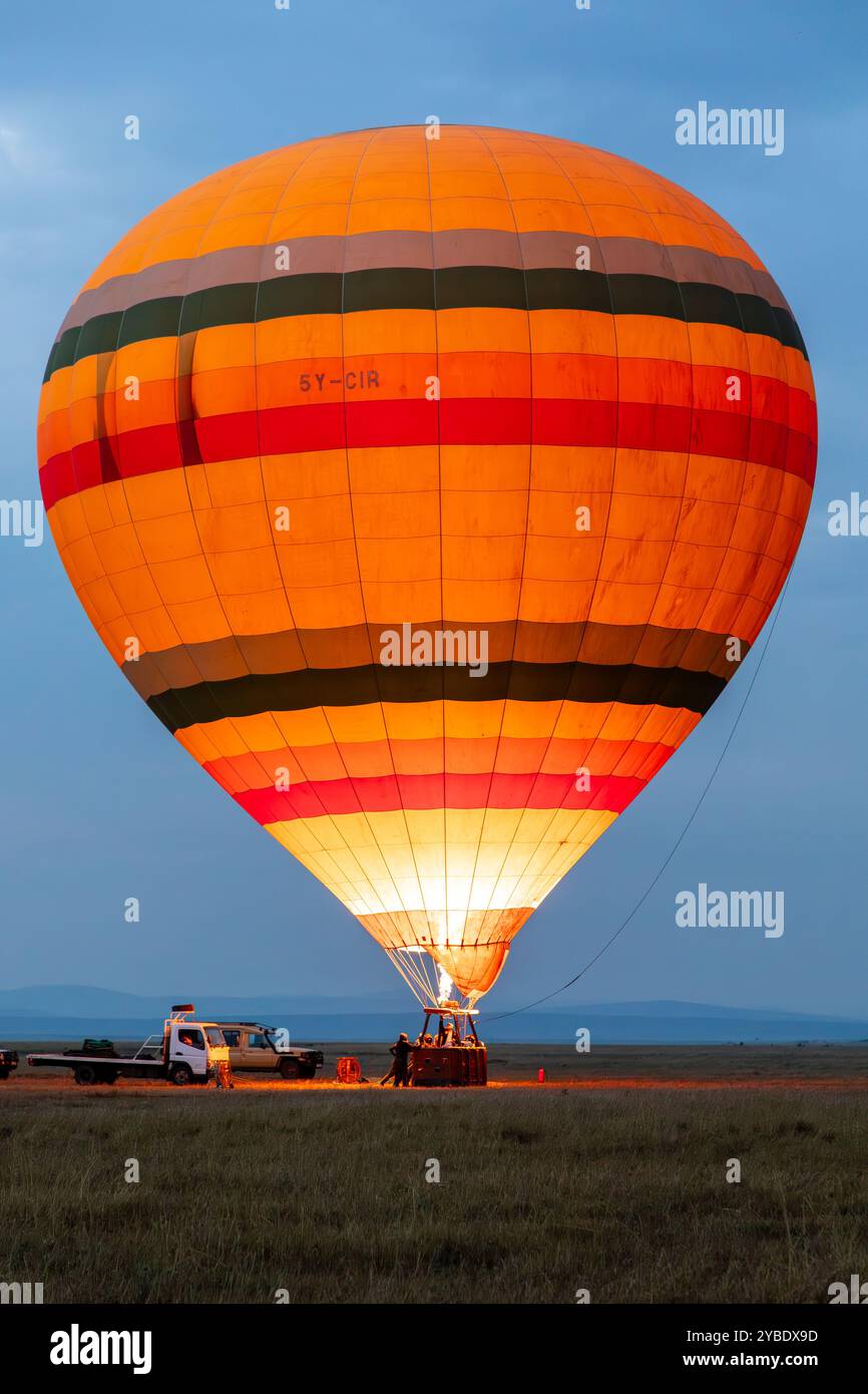 Ariel balloon being inflated before a dawn flight above the Masai Mara ...