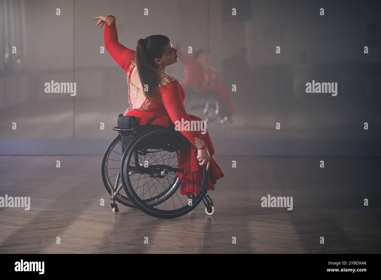 Beautiful dance in a wheelchair of a woman with disability at a dancing ...