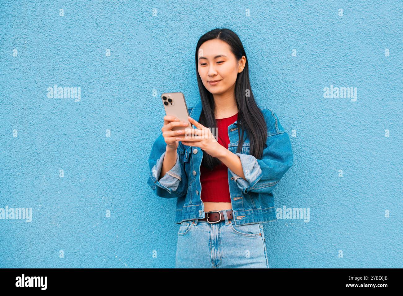 Portrait young Korean Asian woman Generation Z in casual wear using ...