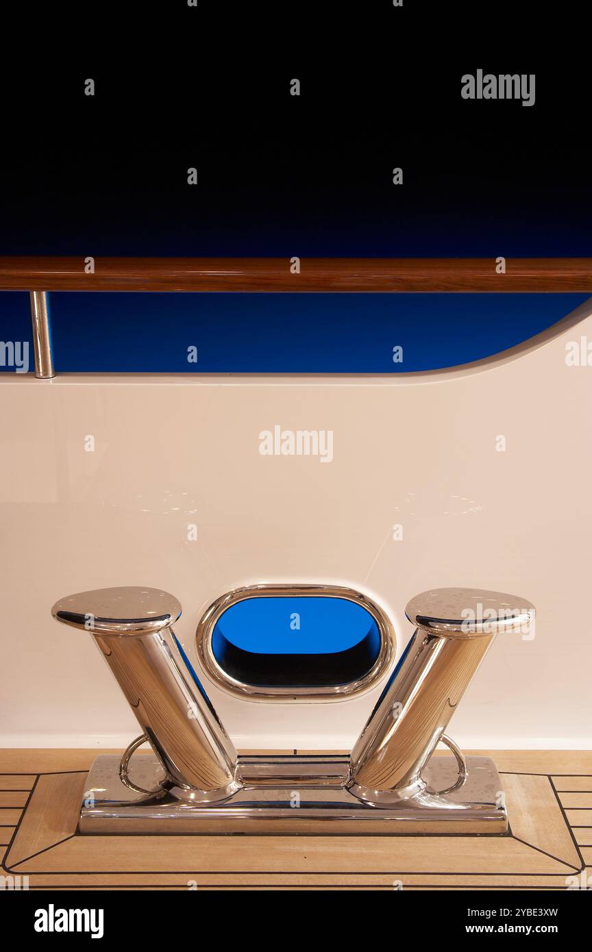 Yacht detail of large polished stainless steel cleats and fairleads on ...