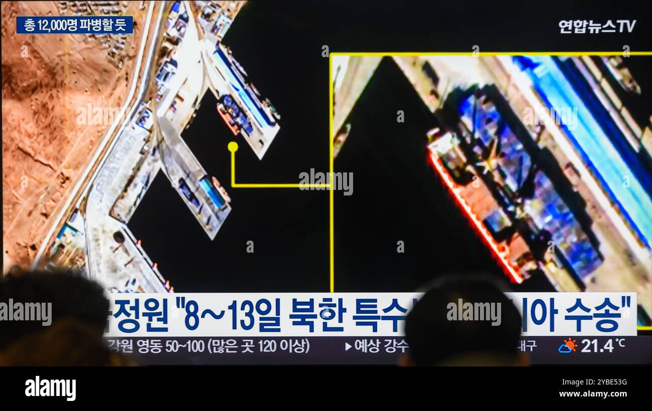 A 24-hour Yonhapnews TV broadcast at Yongsan Railway Station in Seoul showing a news broadcast ...