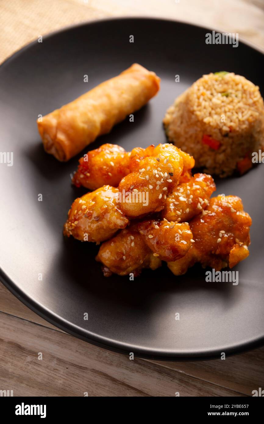 Sweet and sour chicken with fried rice and crispy spring roll, American ...