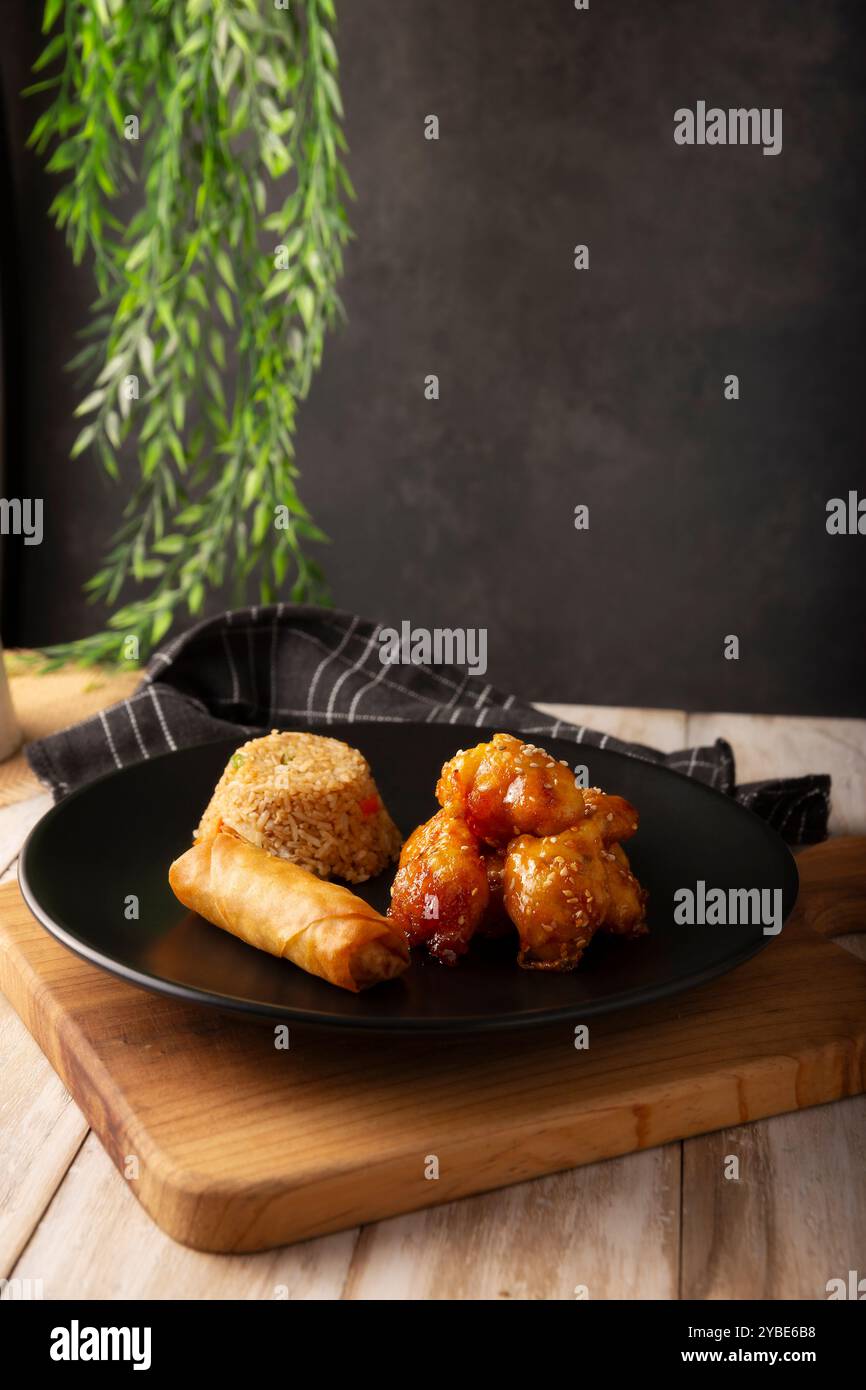 Sweet and sour chicken with fried rice and crispy spring roll, American ...