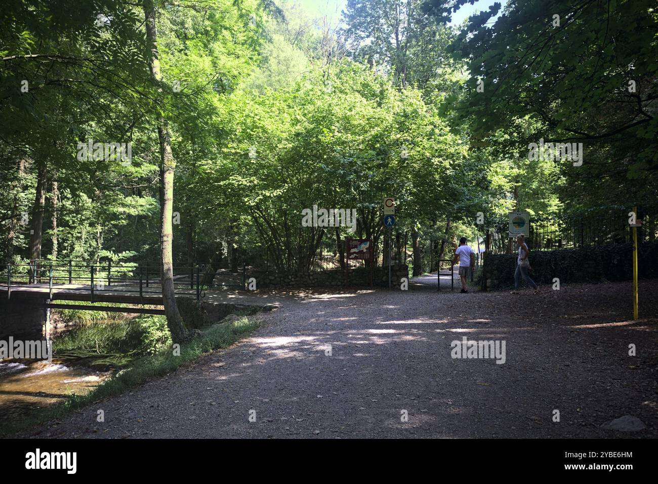 Spinone al lago, Italy - August 2024 - Passageway to a trail in a ...