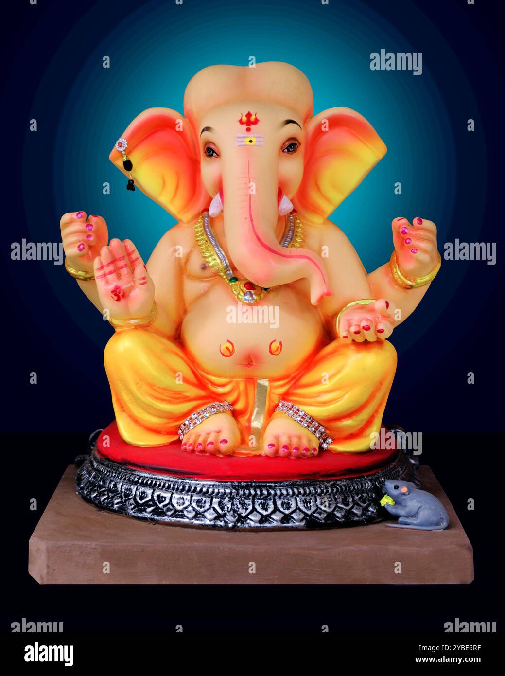 Hindu God Ganesha on Blue background, Ganesha Idol. Ganesh festival ...