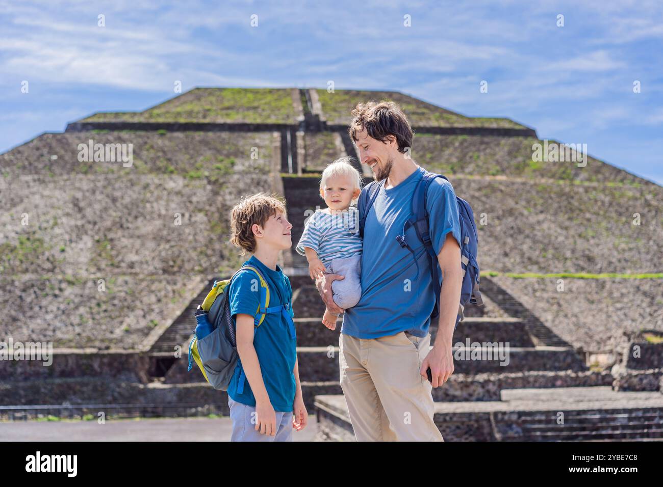 Father with his toddler and teenage sons exploring Teotihuacan, Mexico ...