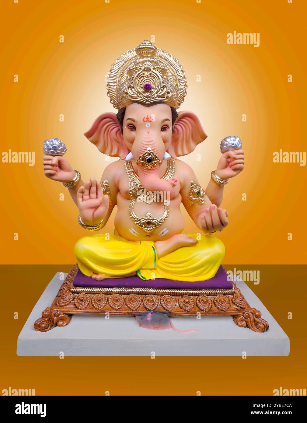 Hindu God Ganesha on orange background, Ganesha Idol. Ganesh festival ...