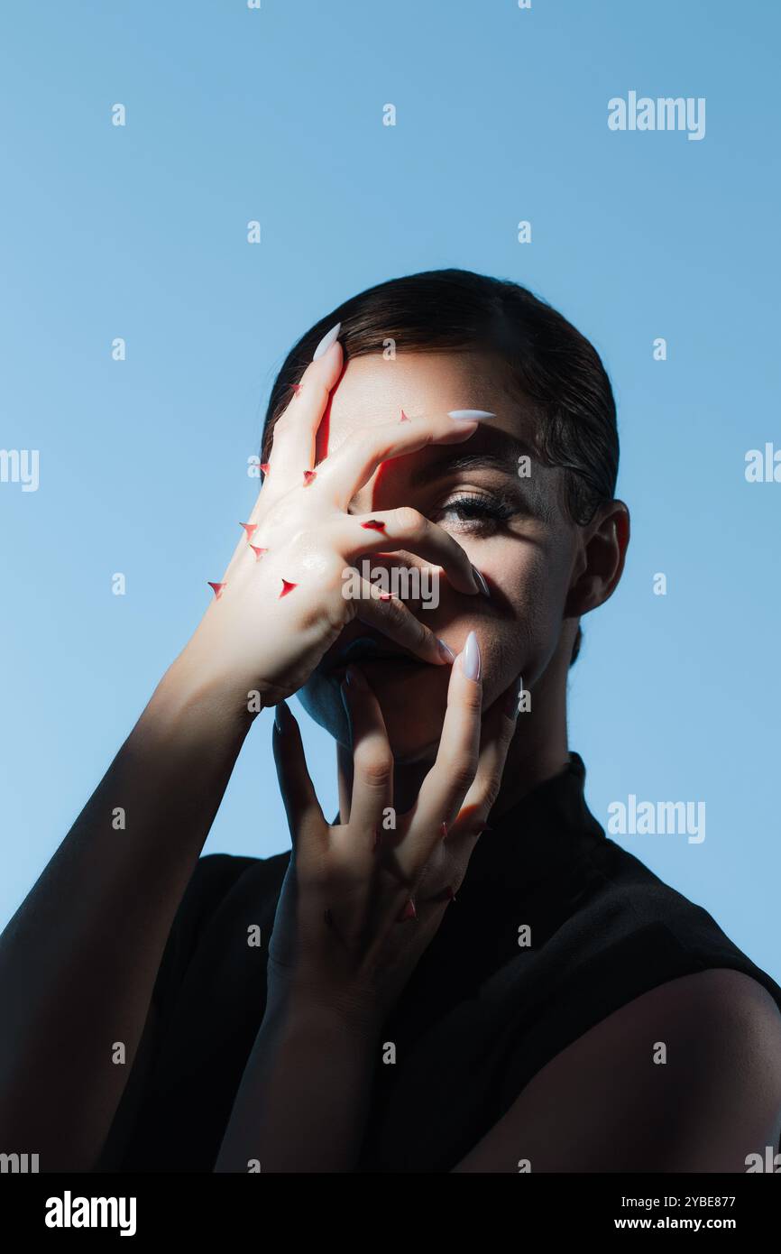 Self-criticism and self-strictness, a concept. A fashion portrait in a ...