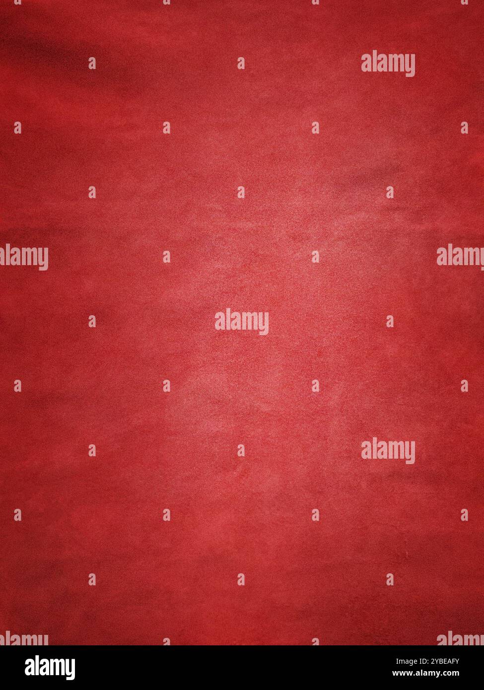 Red suede background with light in the center. Vertical red texture ...