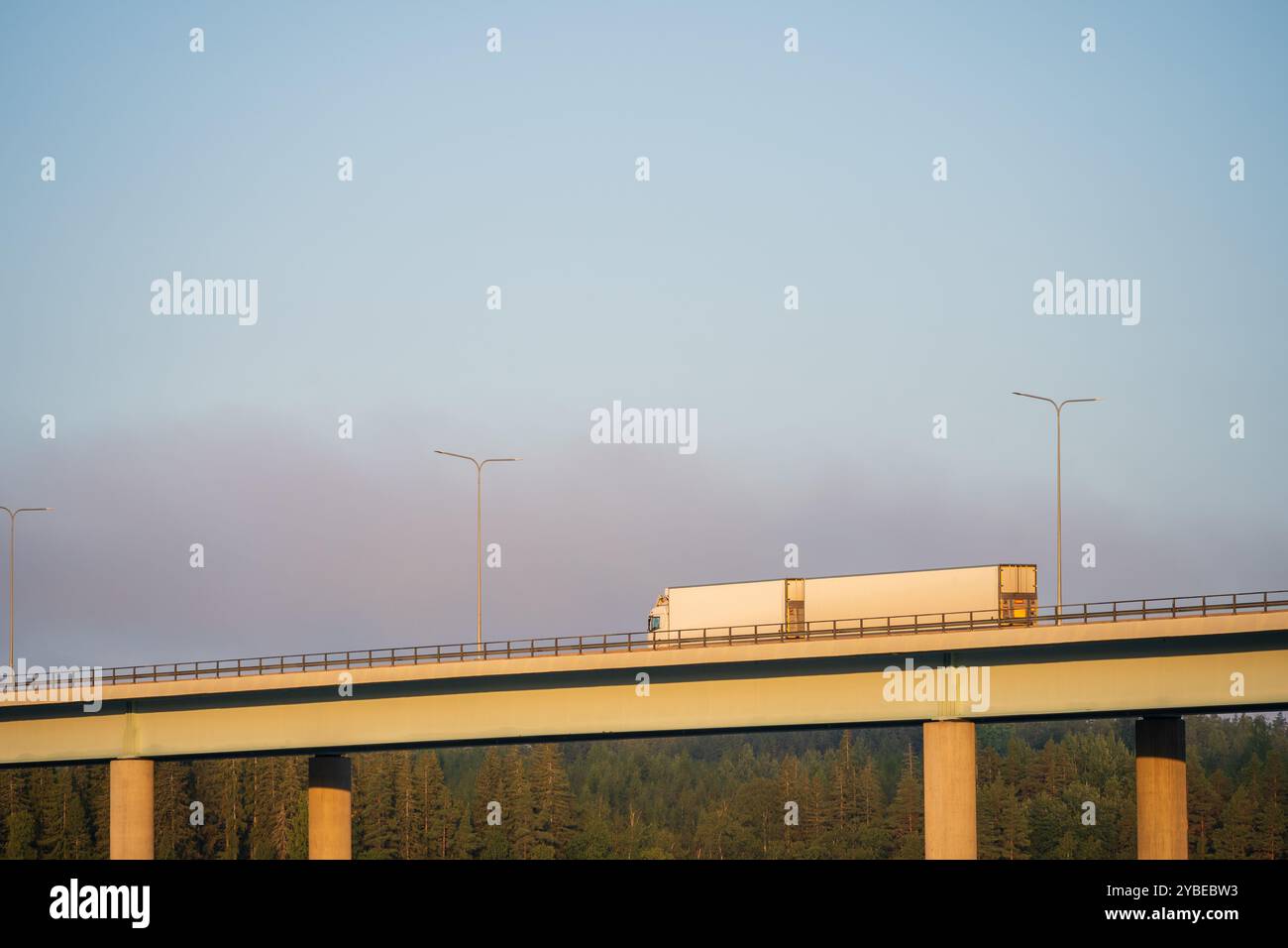 Truck travels along an elevated highway in the morning light Stock ...