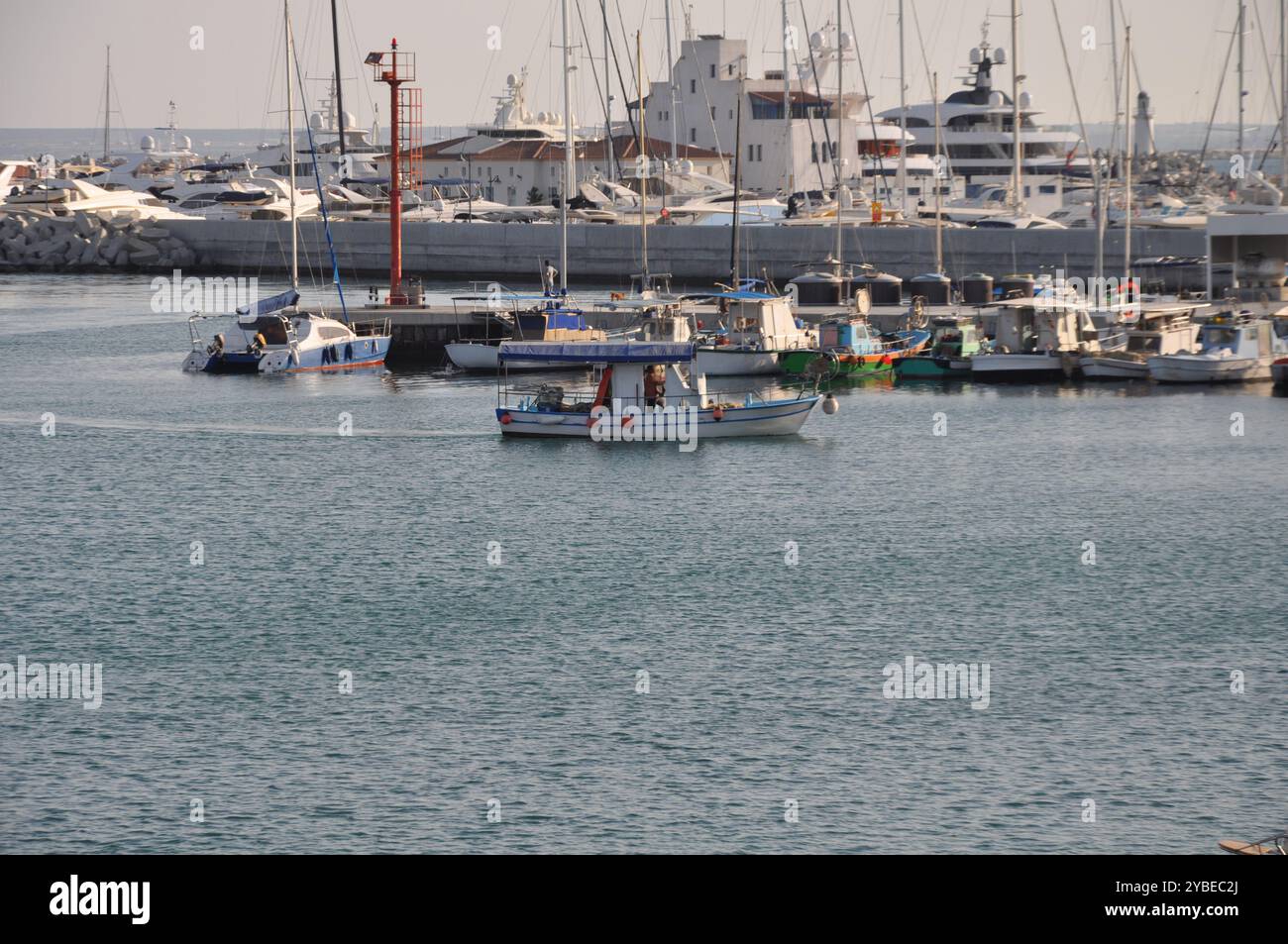 The Limassol Old Port with fishing boats and beautiful buildings in ...