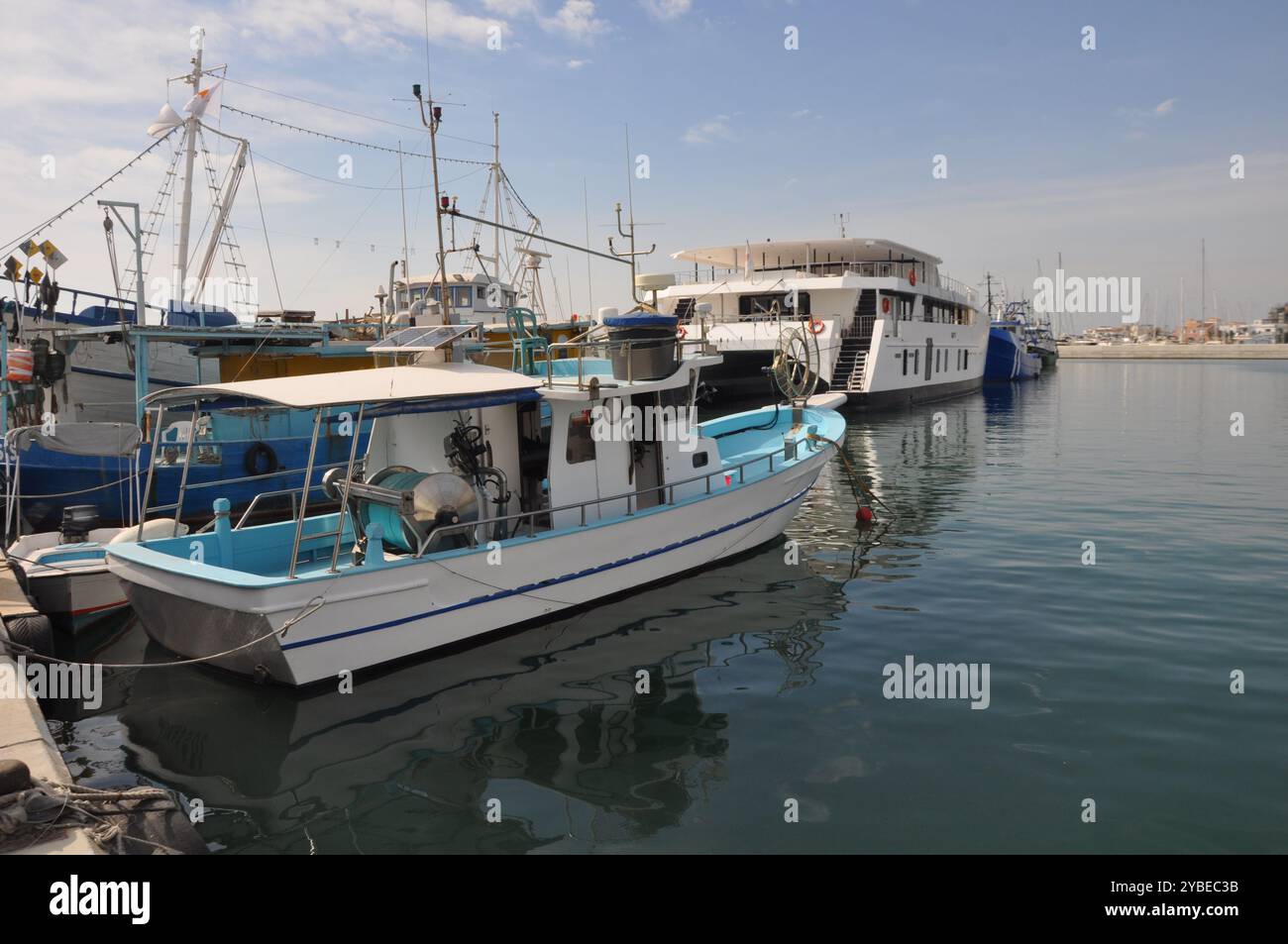 The Limassol Old Port with fishing boats and beautiful buildings in ...