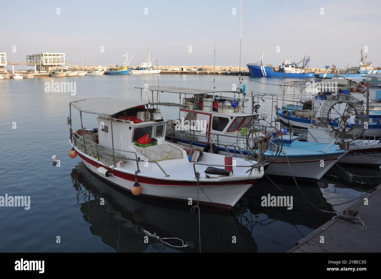 The Limassol Old Port with fishing boats and beautiful buildings in ...