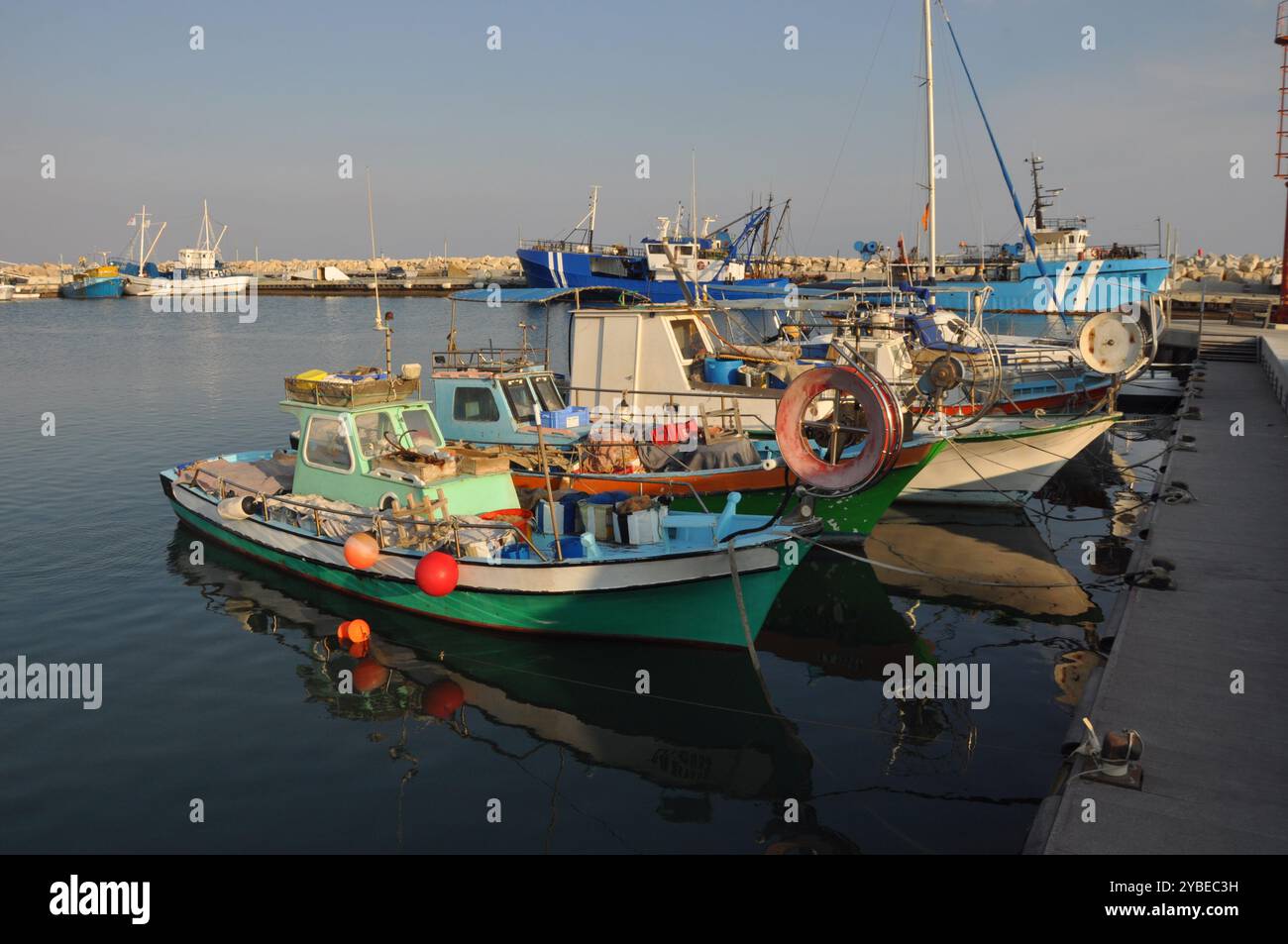 The Limassol Old Port with fishing boats and beautiful buildings in ...