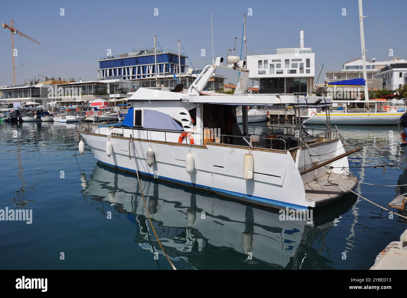 The Limassol Old Port with fishing boats and beautiful buildings in ...
