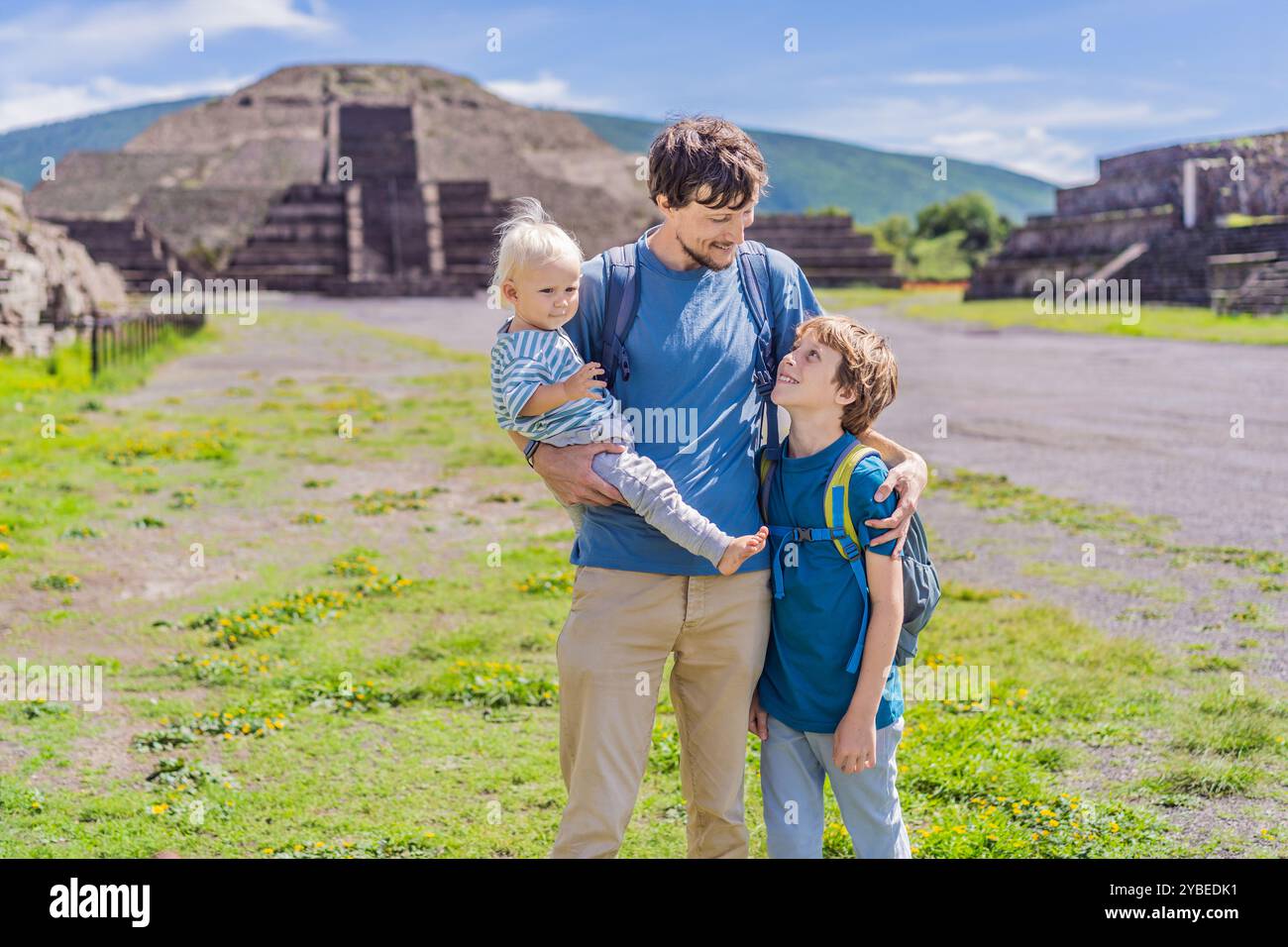 Father with his toddler and teenage sons exploring Teotihuacan, Mexico ...