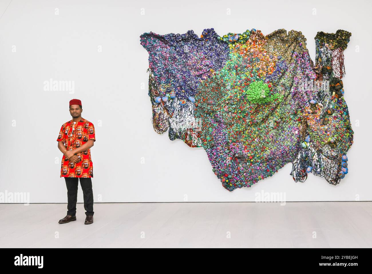 London, UK. 18th Oct, 2024. The artist with 'Fertile Soil', 2023 ...