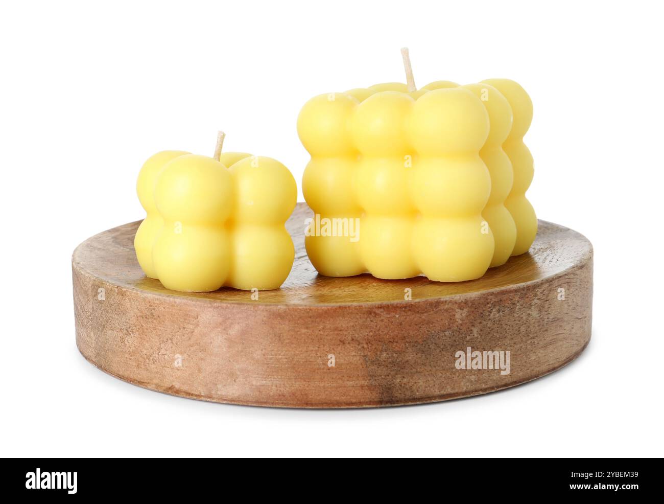 Two yellow bubble candles isolated on white Stock Photo - Alamy