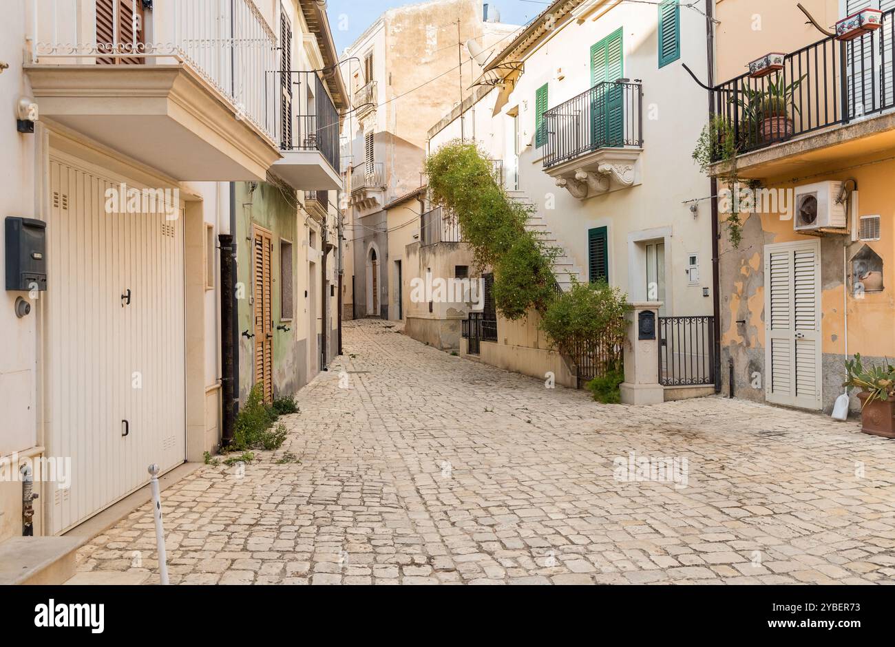 Narrow cobblestone street in the historic center of Scicli, city of ...