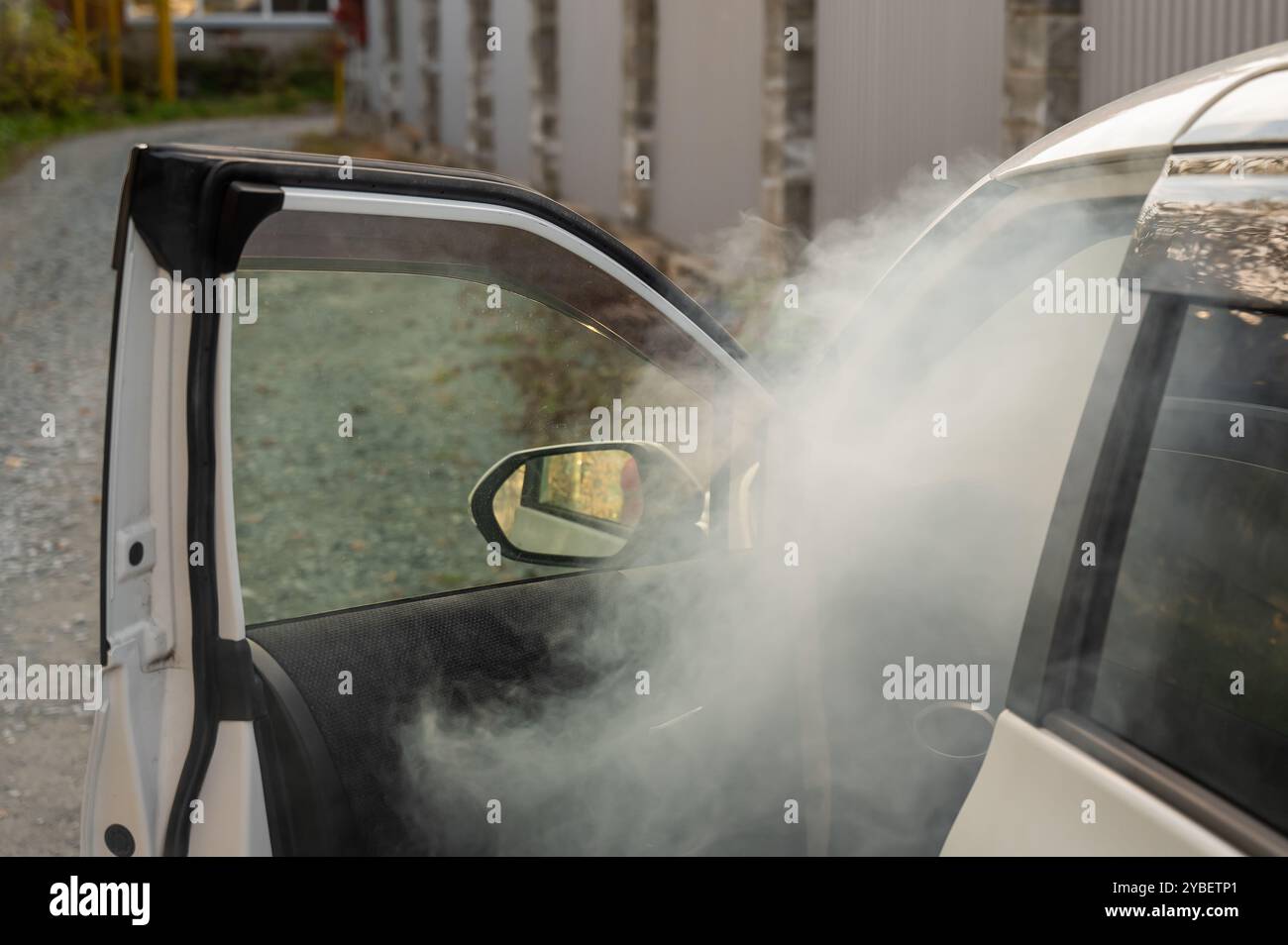 Smoke is coming from inside the car Stock Photo - Alamy