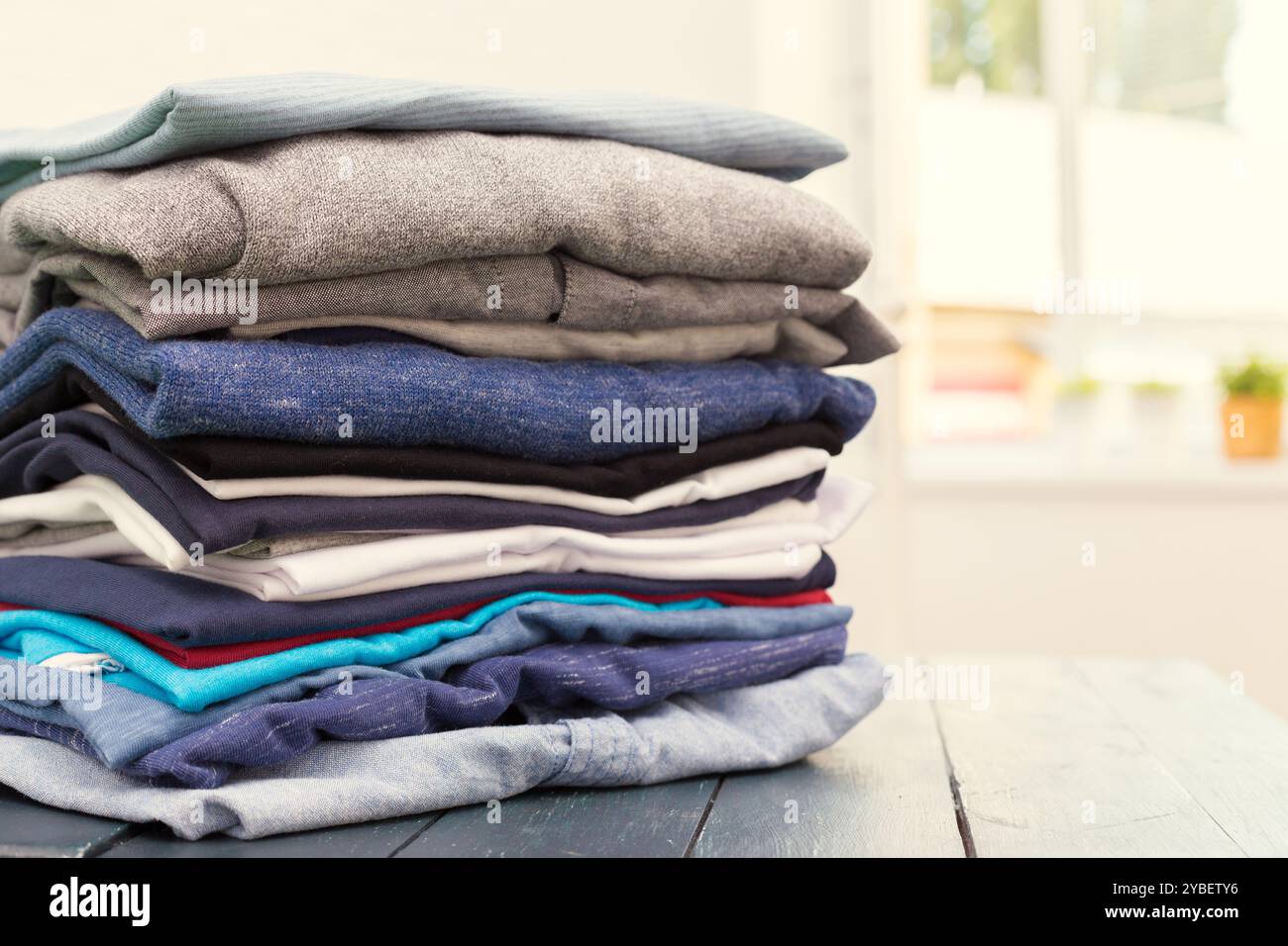 Stack of clothes Stock Photo - Alamy