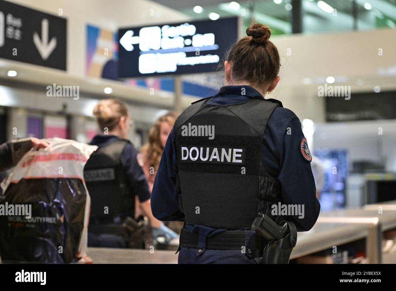 A Customs officer checks a luggage during French Minister of the Budget ...