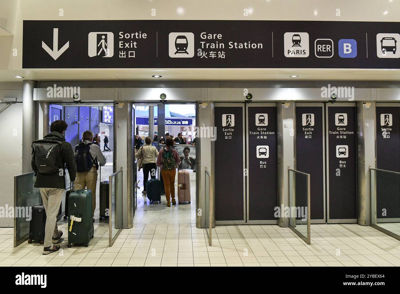 Passengers leave the customs centre during French Minister of the ...