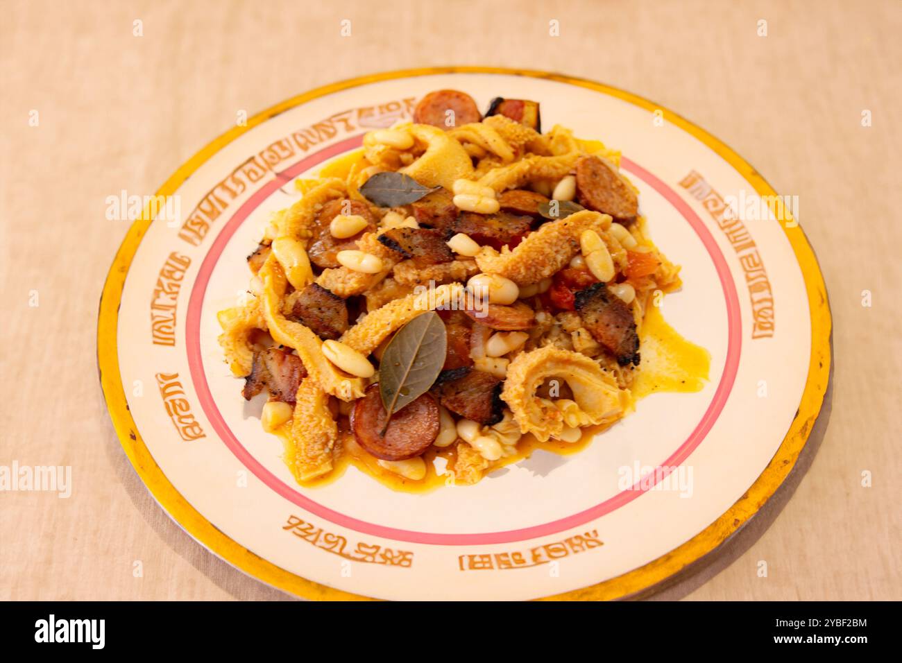 Beef tripe (bucho), beef stomach, tripe on a white plate. Dobradinha ...