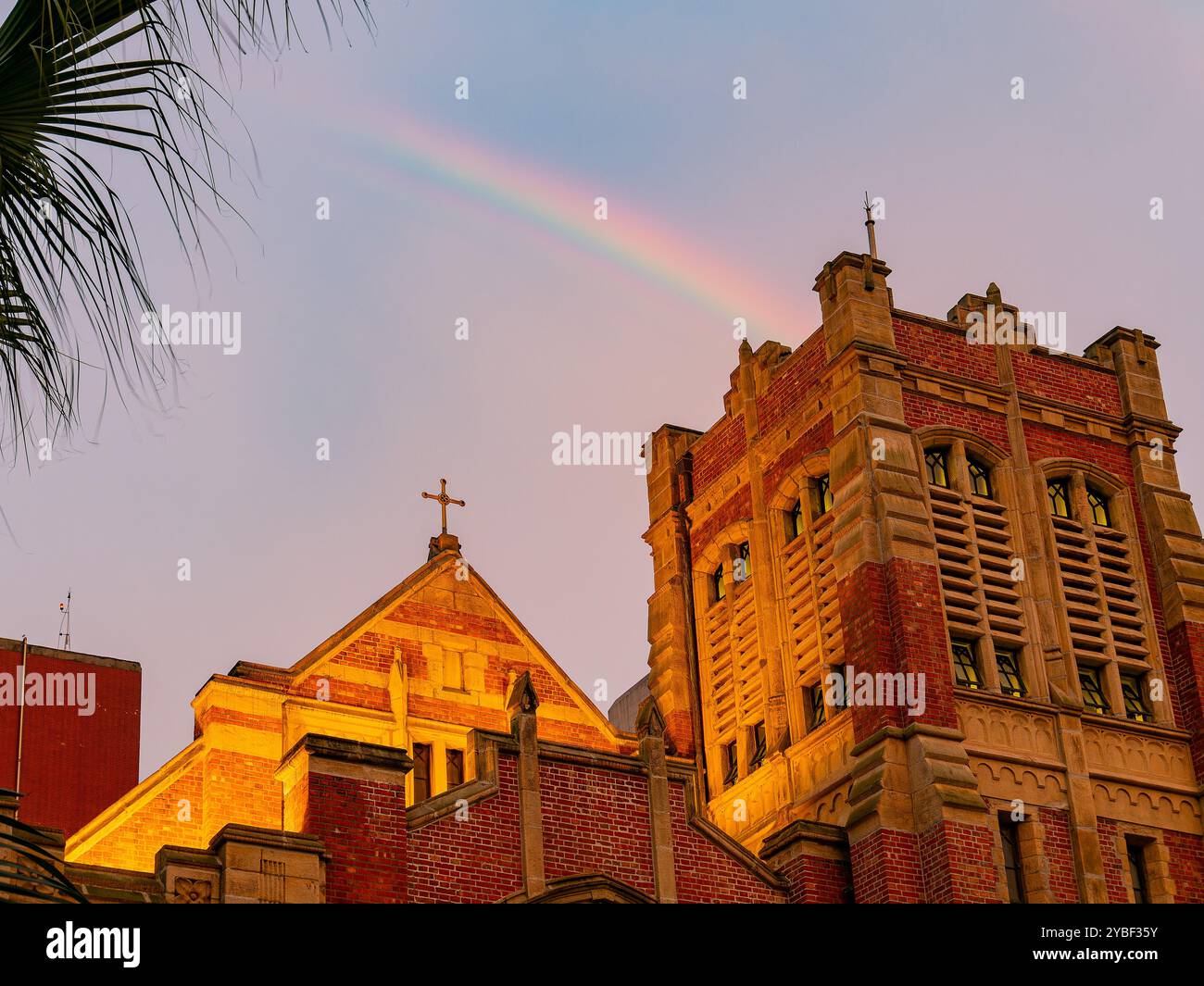 Sunset sky with beautiful rainbow over Jinan Presbyterian Church at ...