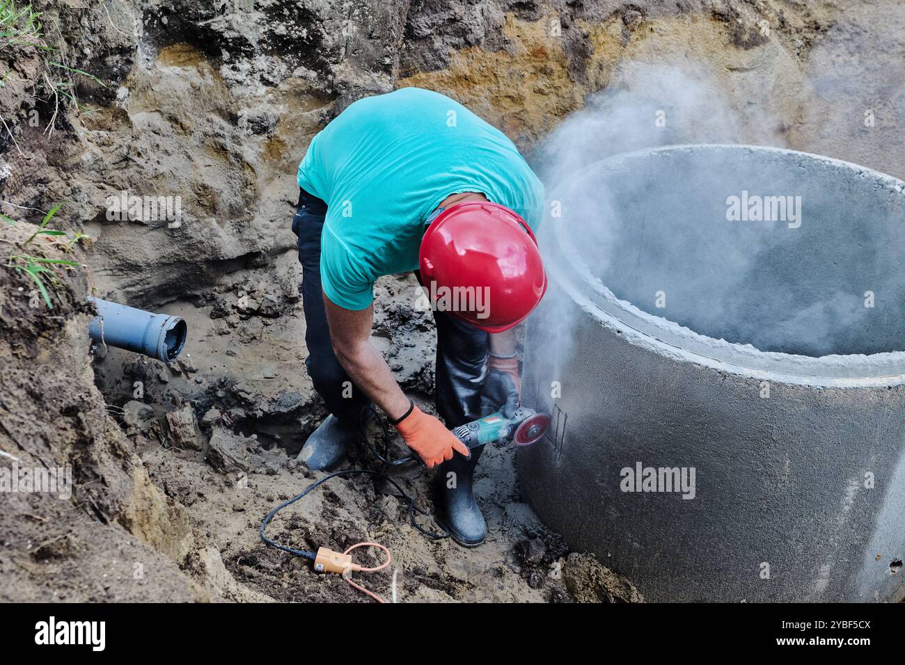 Cutting hole for sewer pipe in concrete septic tank ring using diamond ...
