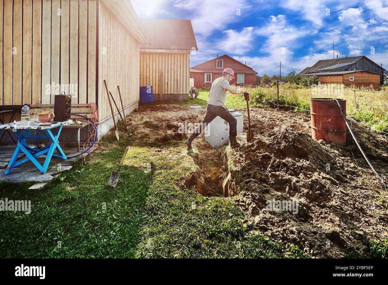 Earthwork during installation of autonomous sewage system in rural ...
