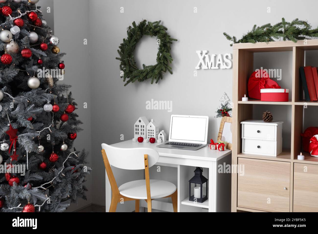 Interior of office with workplace and Christmas tree Stock Photo - Alamy