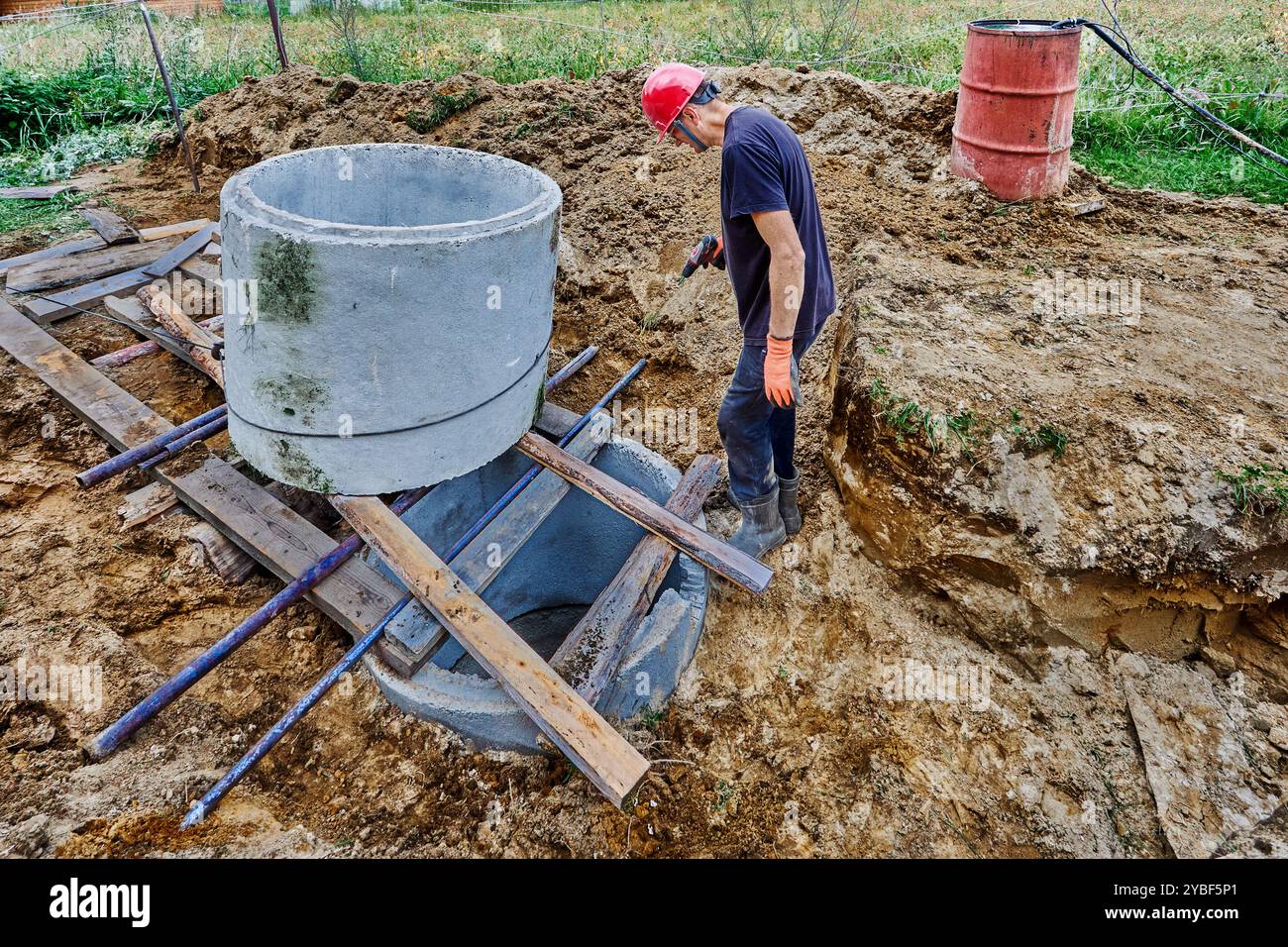 Installation of concrete rings one above other, when installing an ...