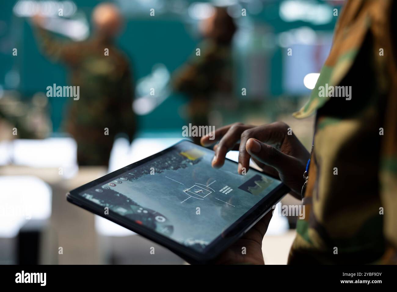 Trooper monitoring the operational area via CCTV surveillance footage ...