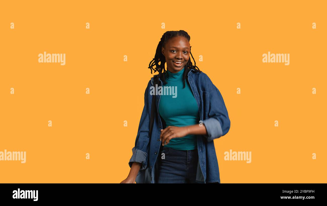 Thrilled young girl doing happy dance, feeling jolly, isolated over ...