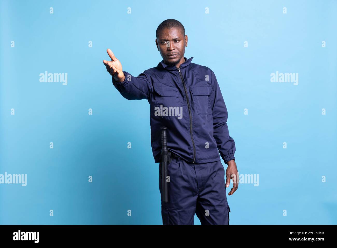 African american security guard indicating the right direction for ...
