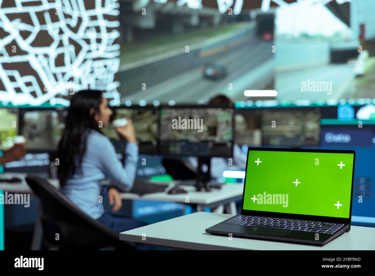 Courier agency employees monitoring cargo shipment with a greenscreen ...