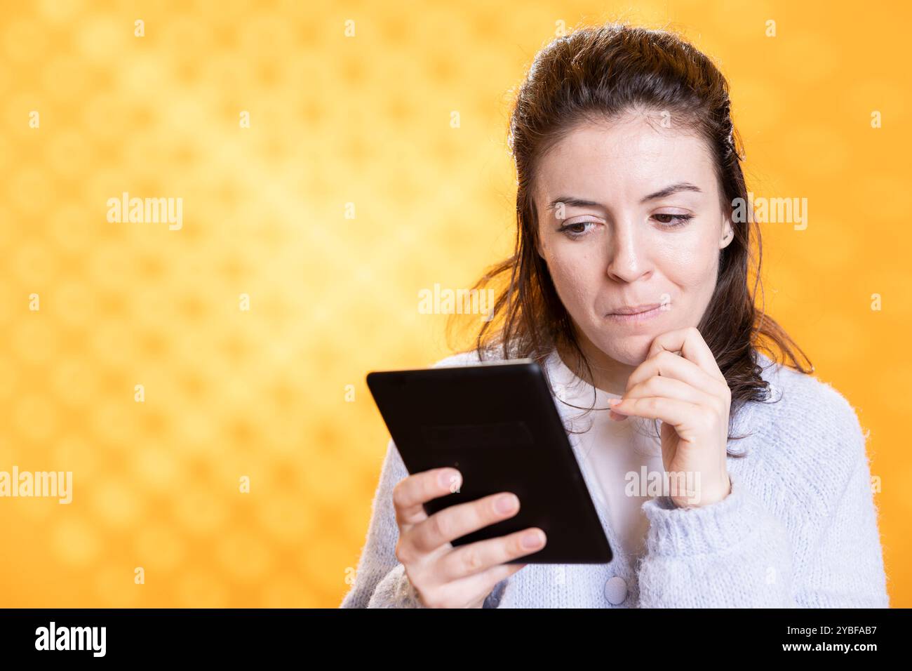 Woman reading captivating ebook on ereader device, enjoying hobby ...