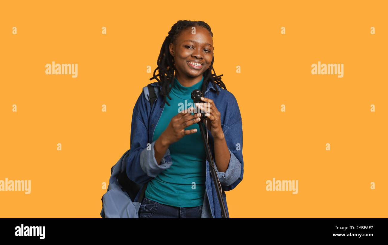 Portrait of african american motivational speaker talking in microphone ...