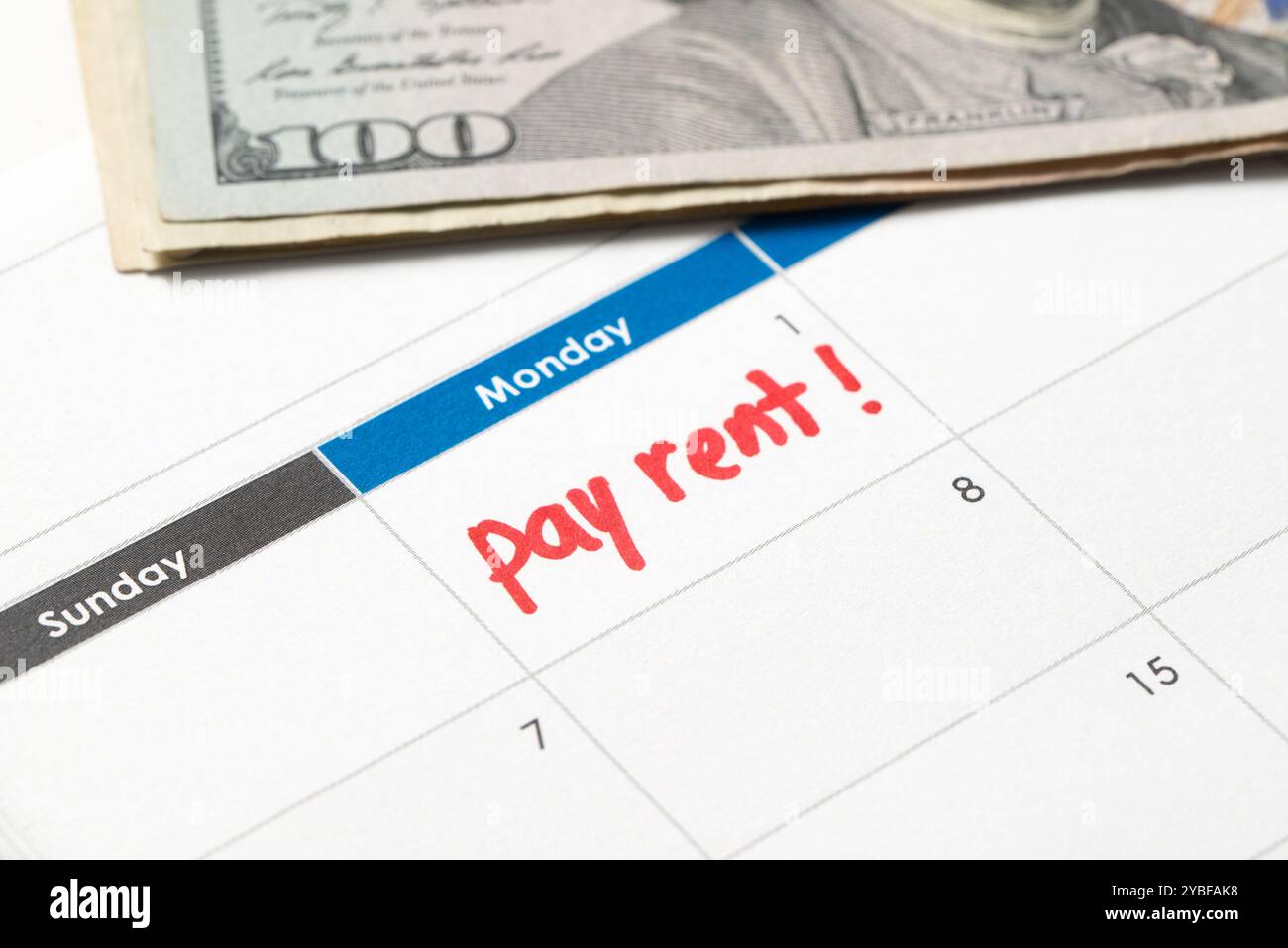 Pay rent reminder written on calendar Stock Photo - Alamy