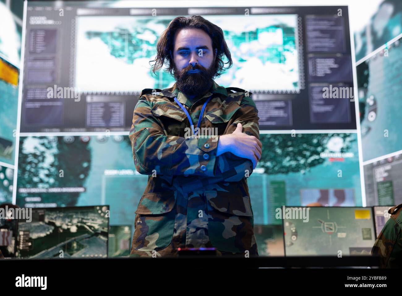 Army officer examining information on a hologram projection in control ...