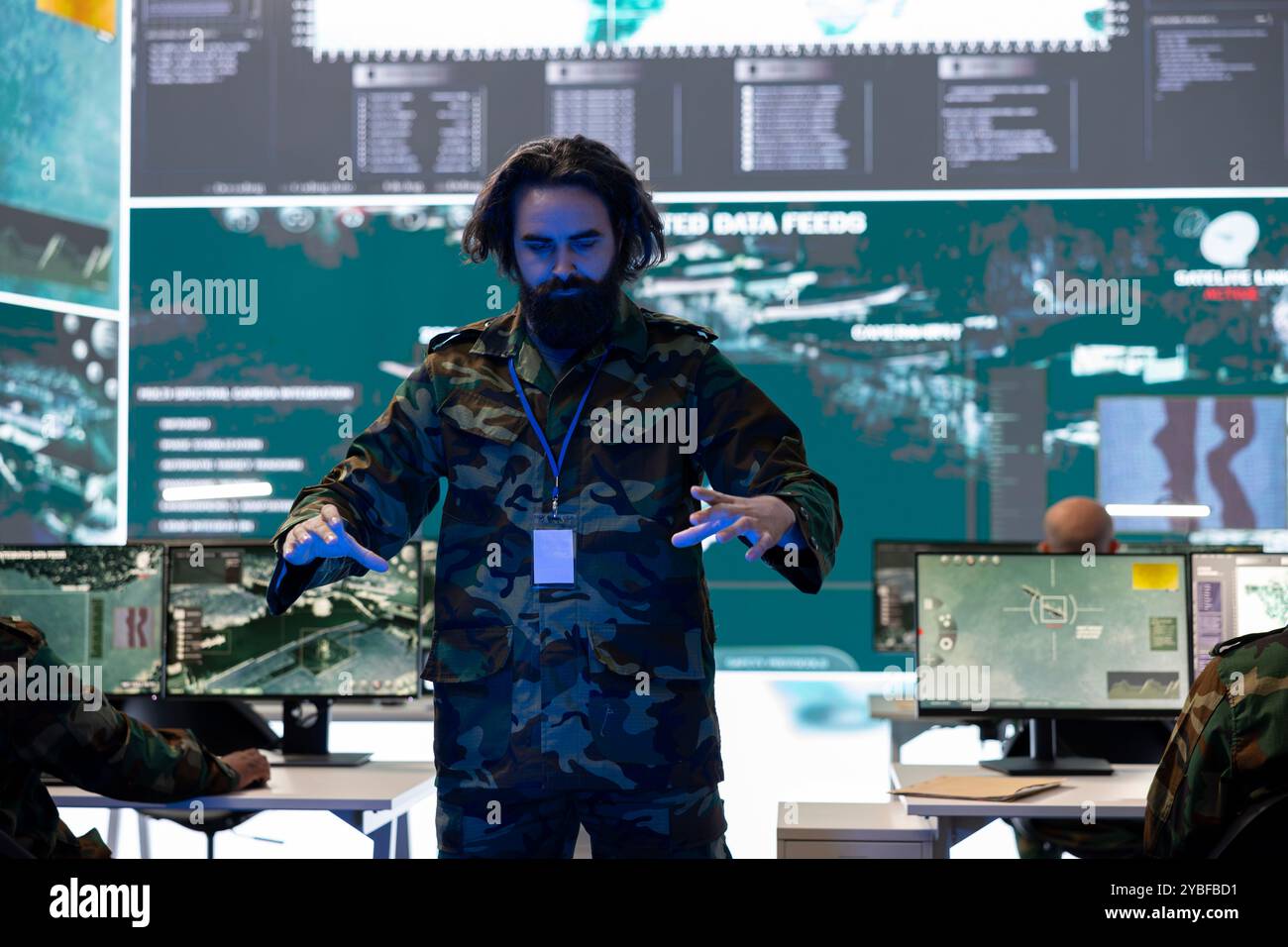 Special operations soldier examines battlefield data on a hologram ...