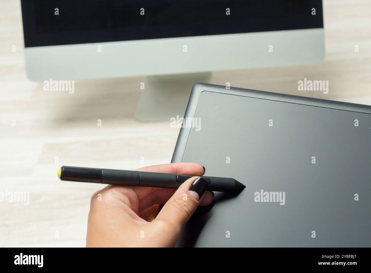Hand of graphic designer working with stilus and tablet Stock Photo - Alamy