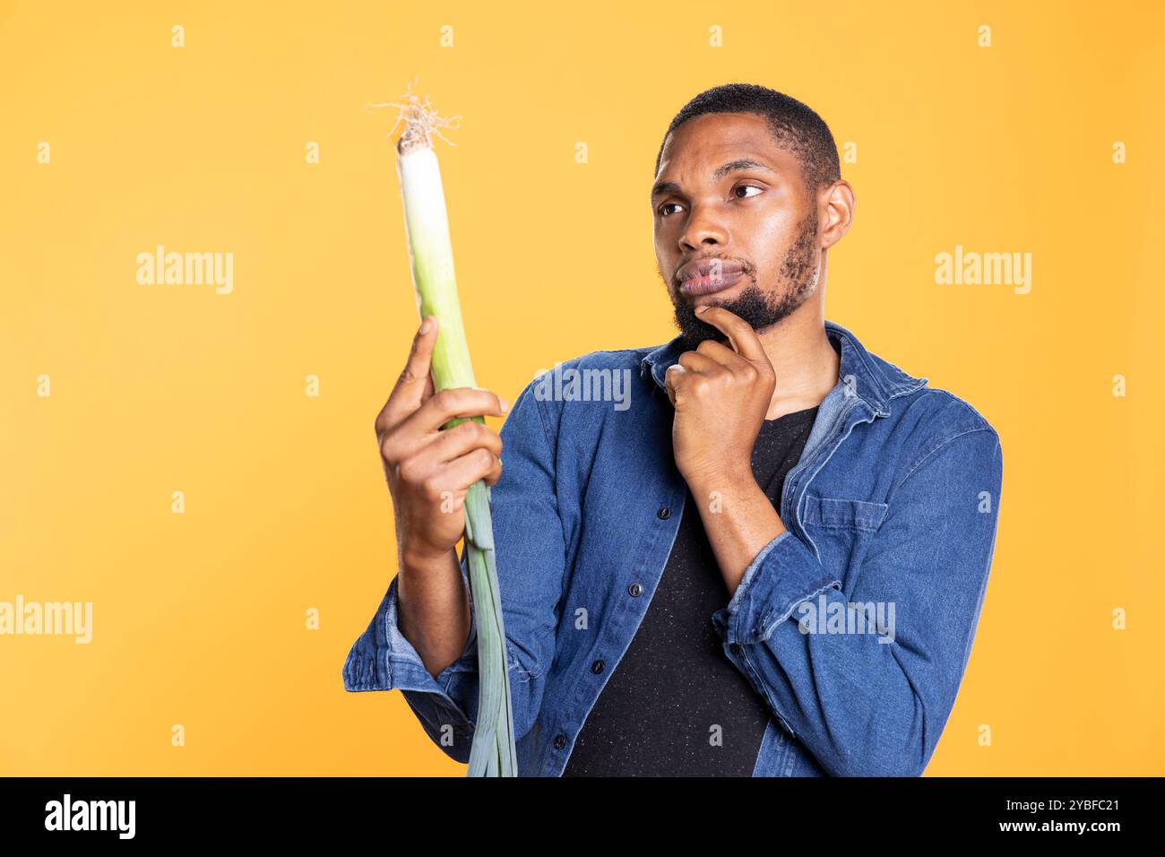Focused young african man examines hi-res stock photography and images ...